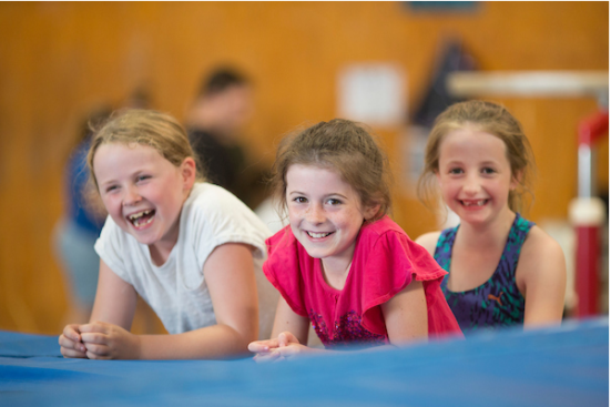 3 gymnastics girls smiling | GymnasticsNZ